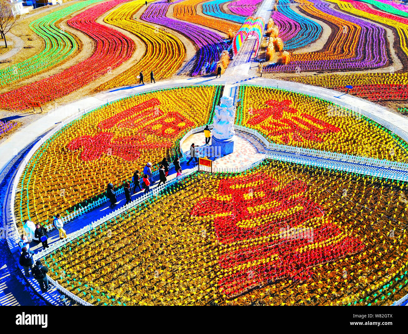 --FILE--Aerial view of colourful patterns of Chinese characters made of ...