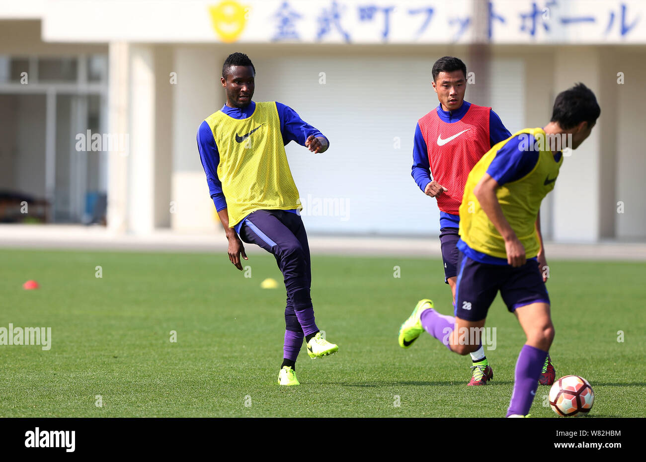 Nigerian football player John Obi Mikel, left, and other players of ...