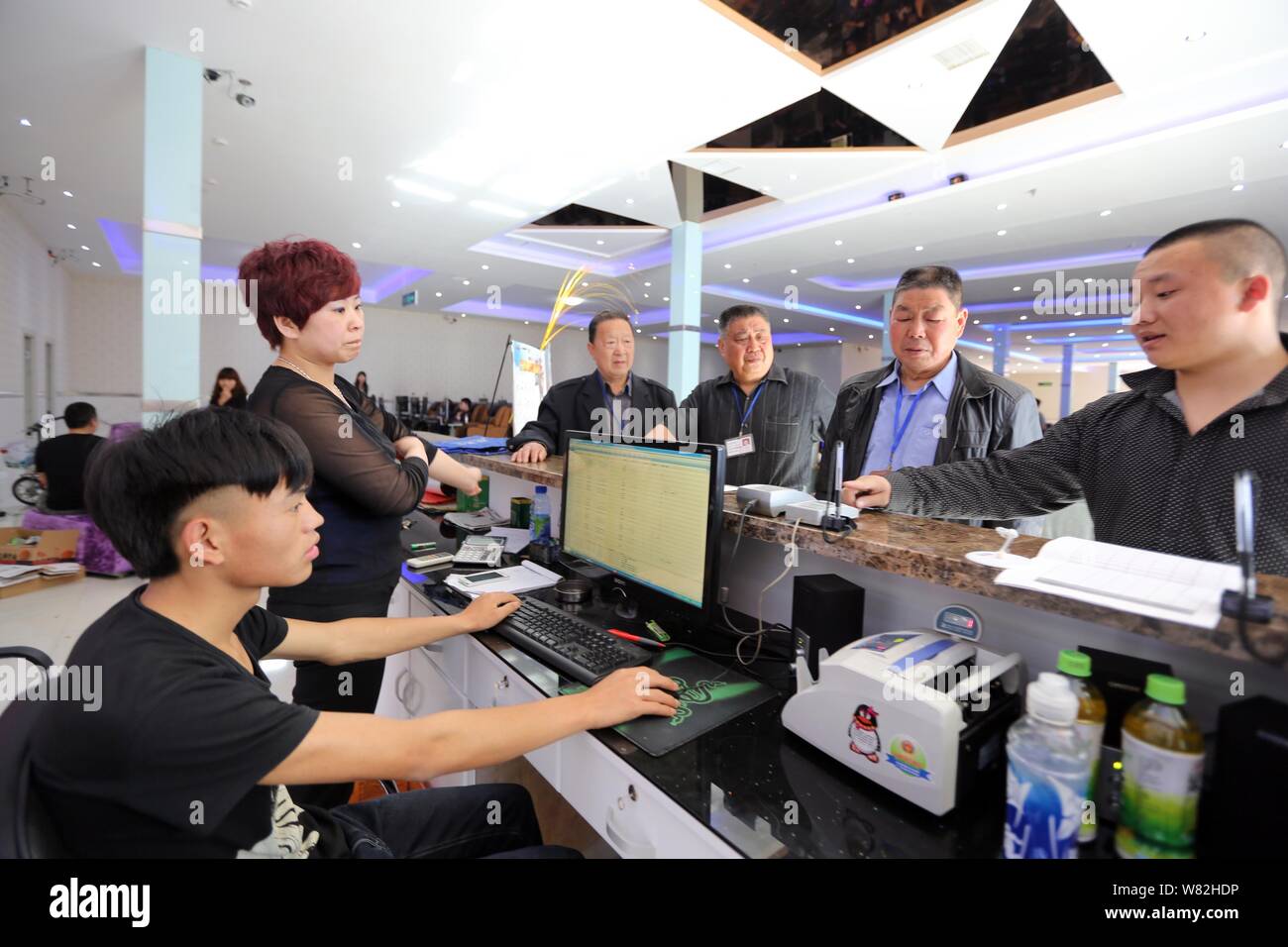 --FILE--Chinese police and law enforcement officers check ID cards of ...