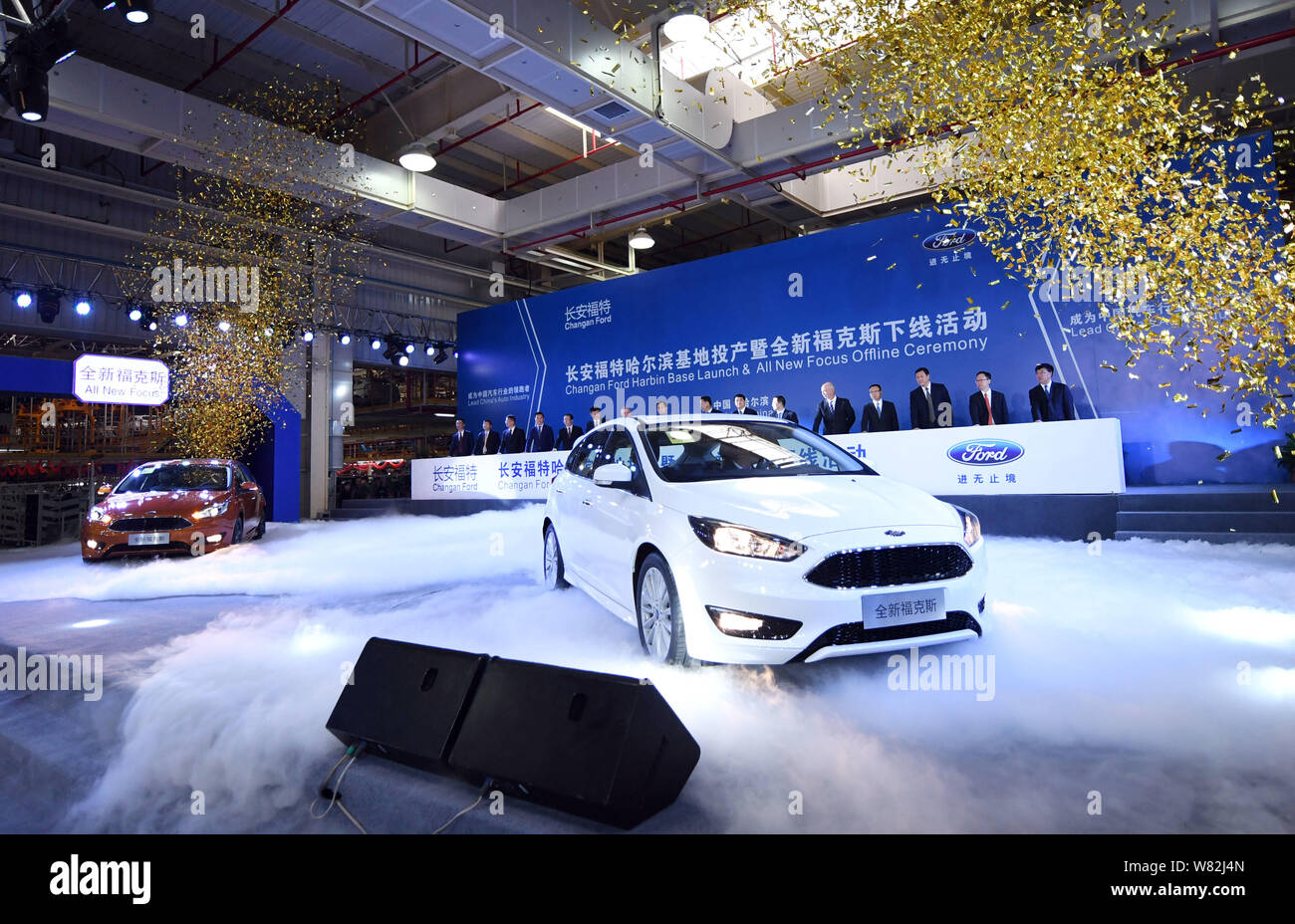 Officers and executives pose during the launch ceremony of the fifth ...