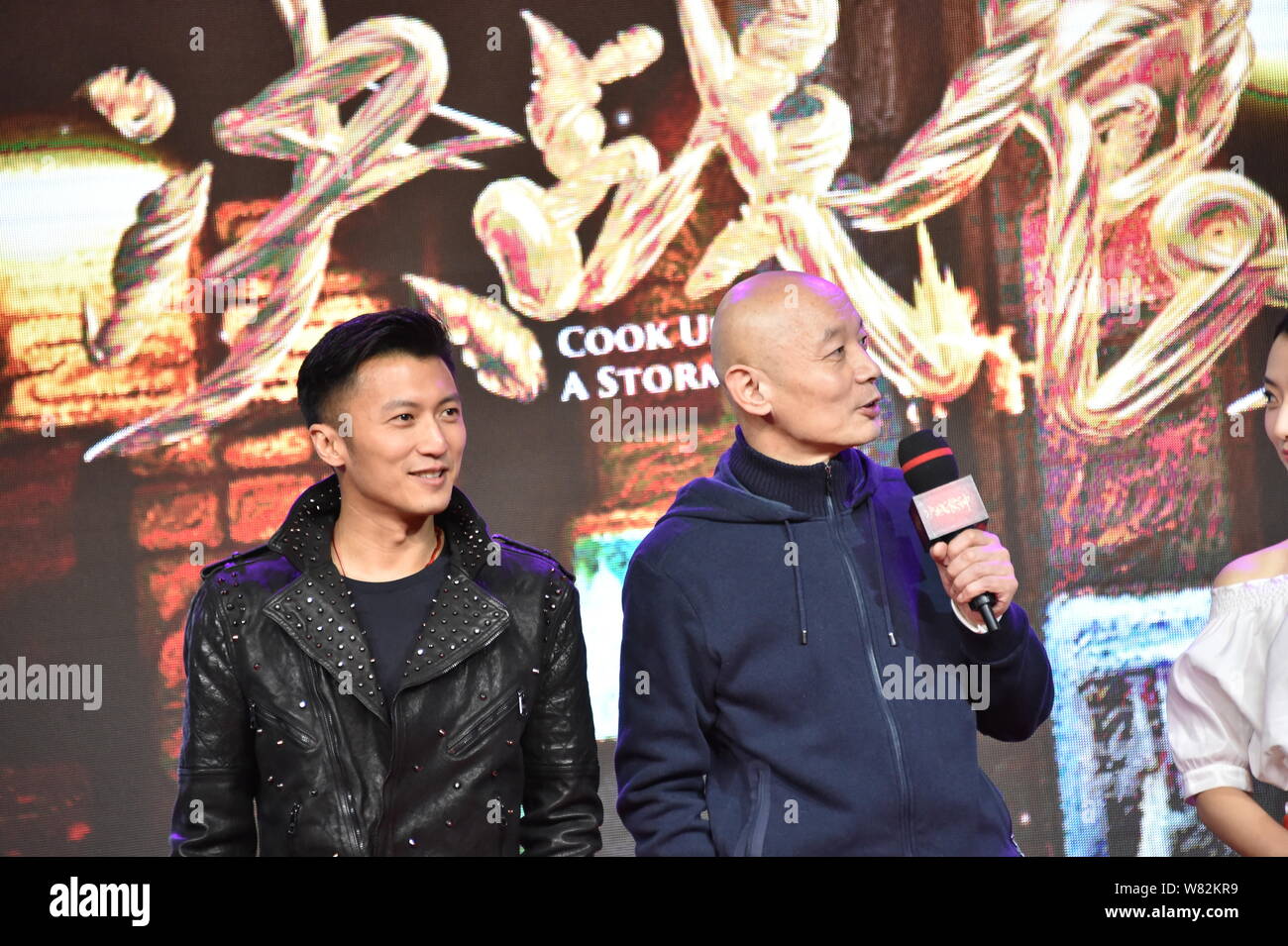 Chinese actor Ge You, center, speaks next to Hong Kong singer and actor ...