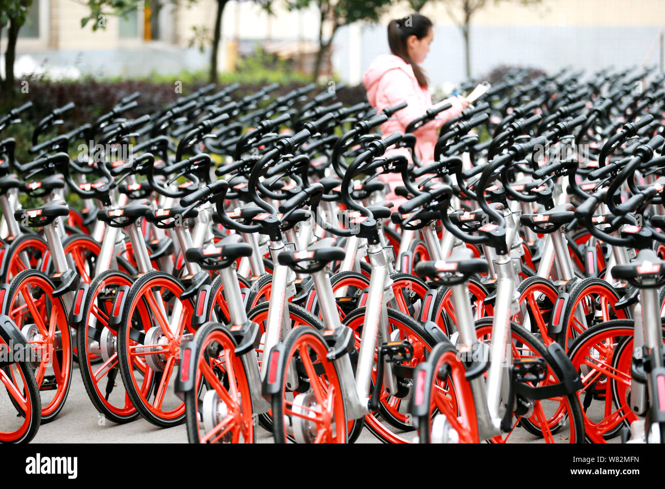 A Chinese worker checks newly-made bicycles of Chinese bike sharing ...