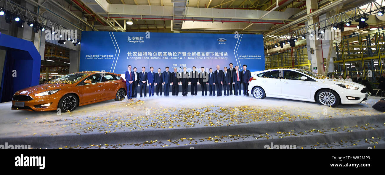 Officers and executives pose during the launch ceremony of the fifth ...