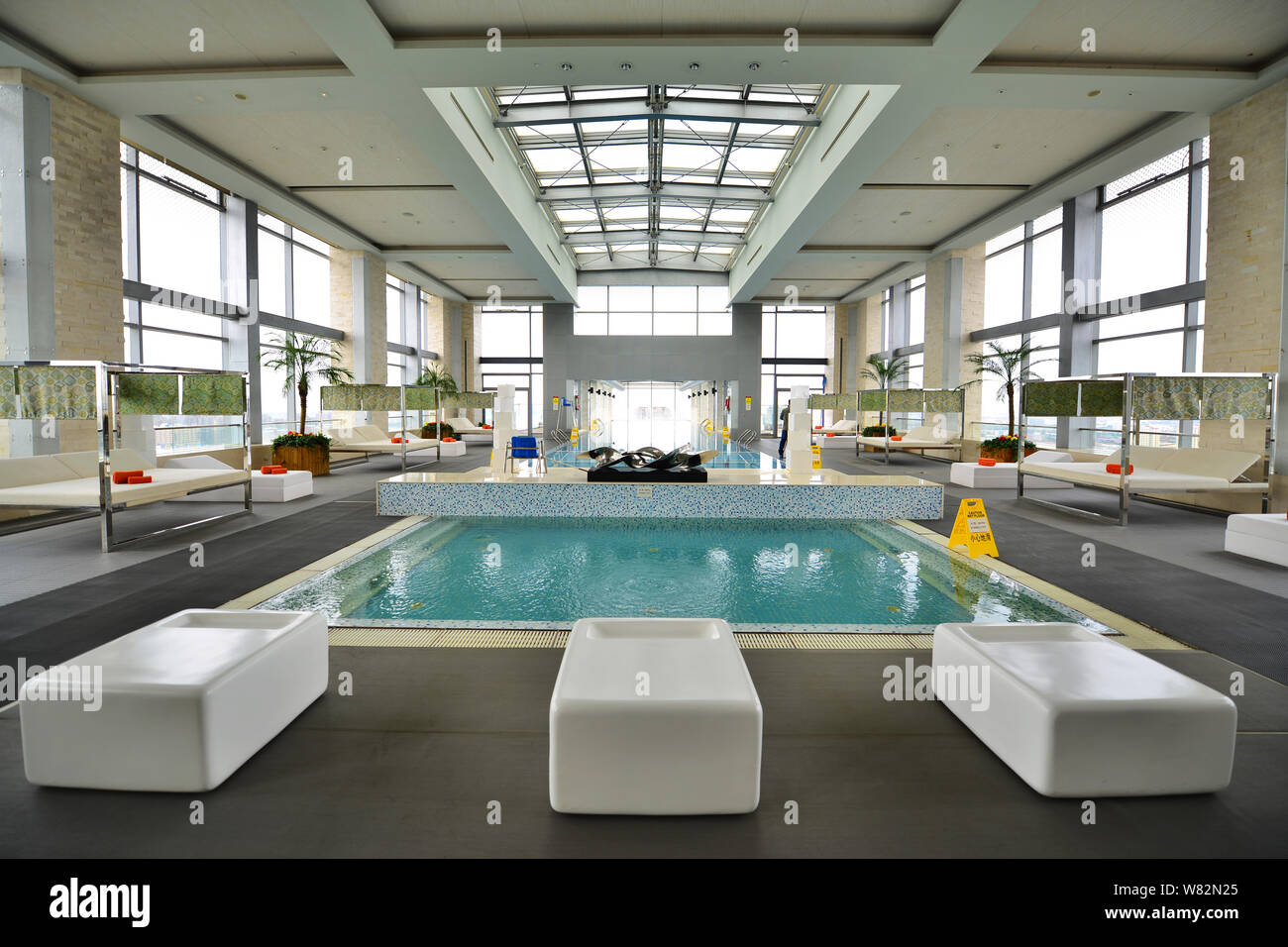 Interior view of a swimming pool with one end suspended in the air at a ...