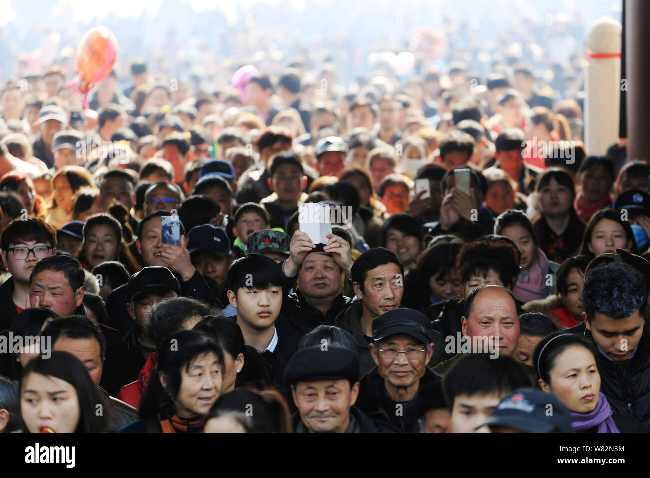 Chinese worshippers crowd the Taiping Bridge to pray for good luck on ...