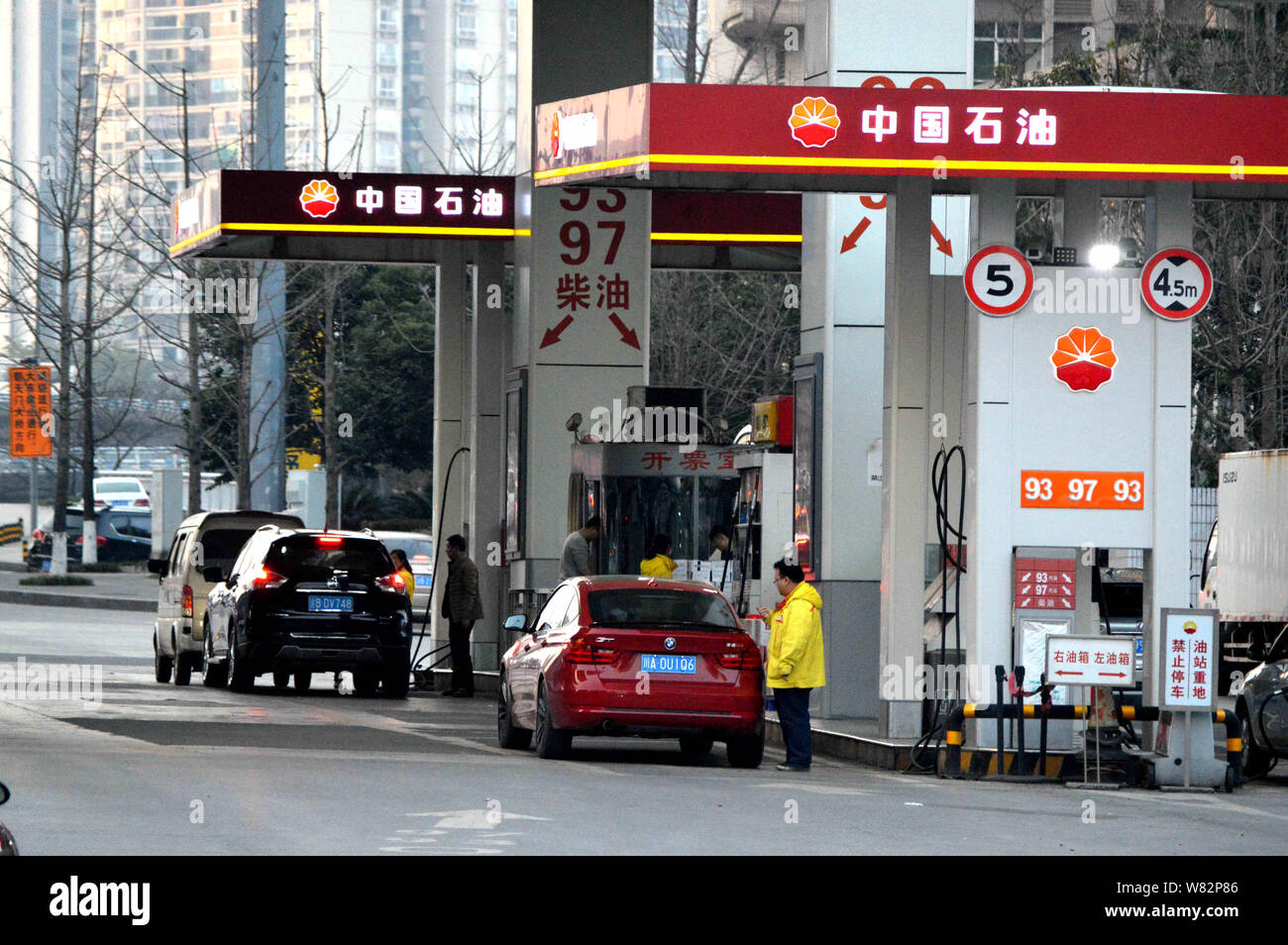 --FILE--Cars are being refueled at a gas station of PetroChina, a ...