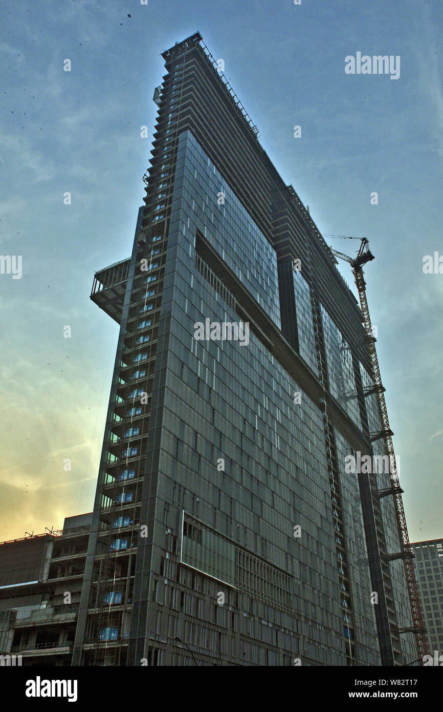 View of a narrow 50-storey skyscraper under construction in Hangzhou ...