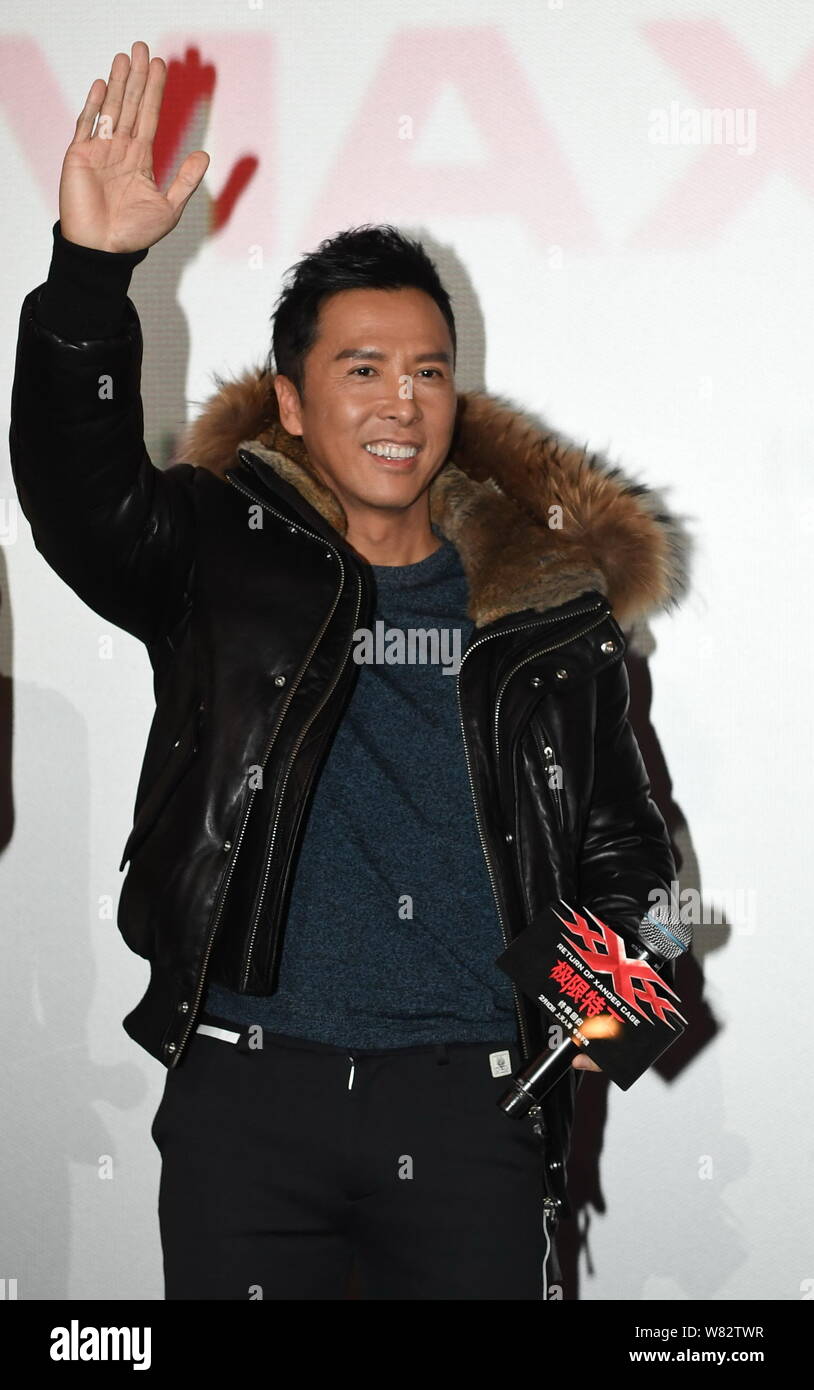 Hong Kong actor Donnie Yen waves as he arrives for a fan meeting to ...