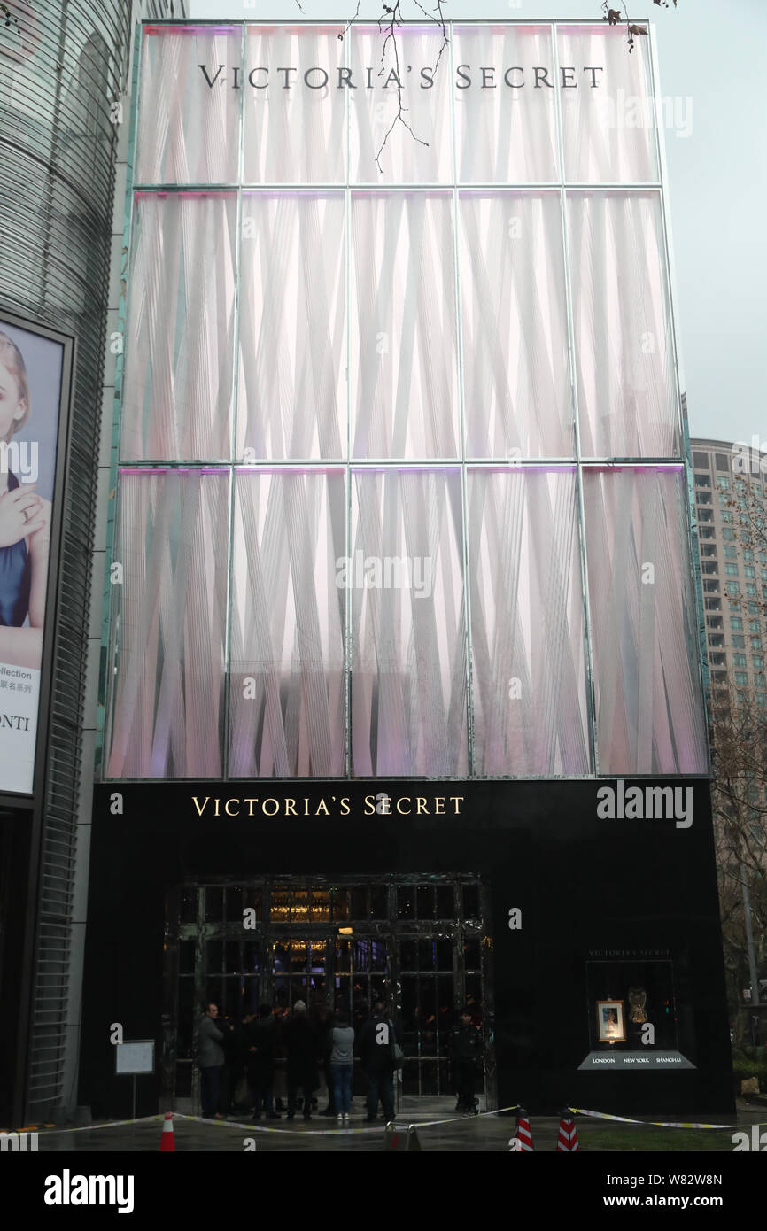 Pedestrians walk past the Victoria's Secret flagship store on Huaihai ...