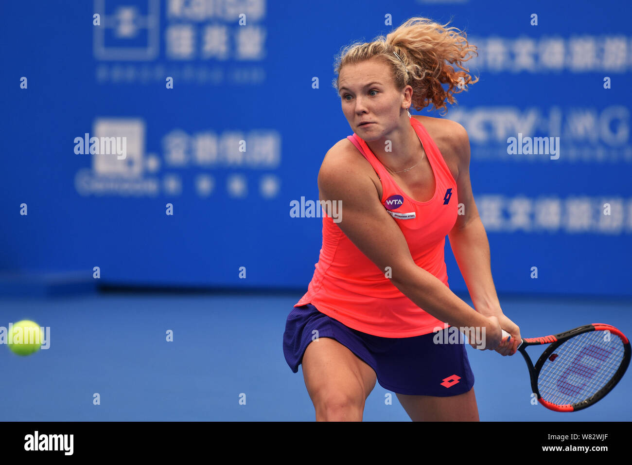 Katerina Siniakova of Czech Republic returns a shot to Nina Stojanovic ...