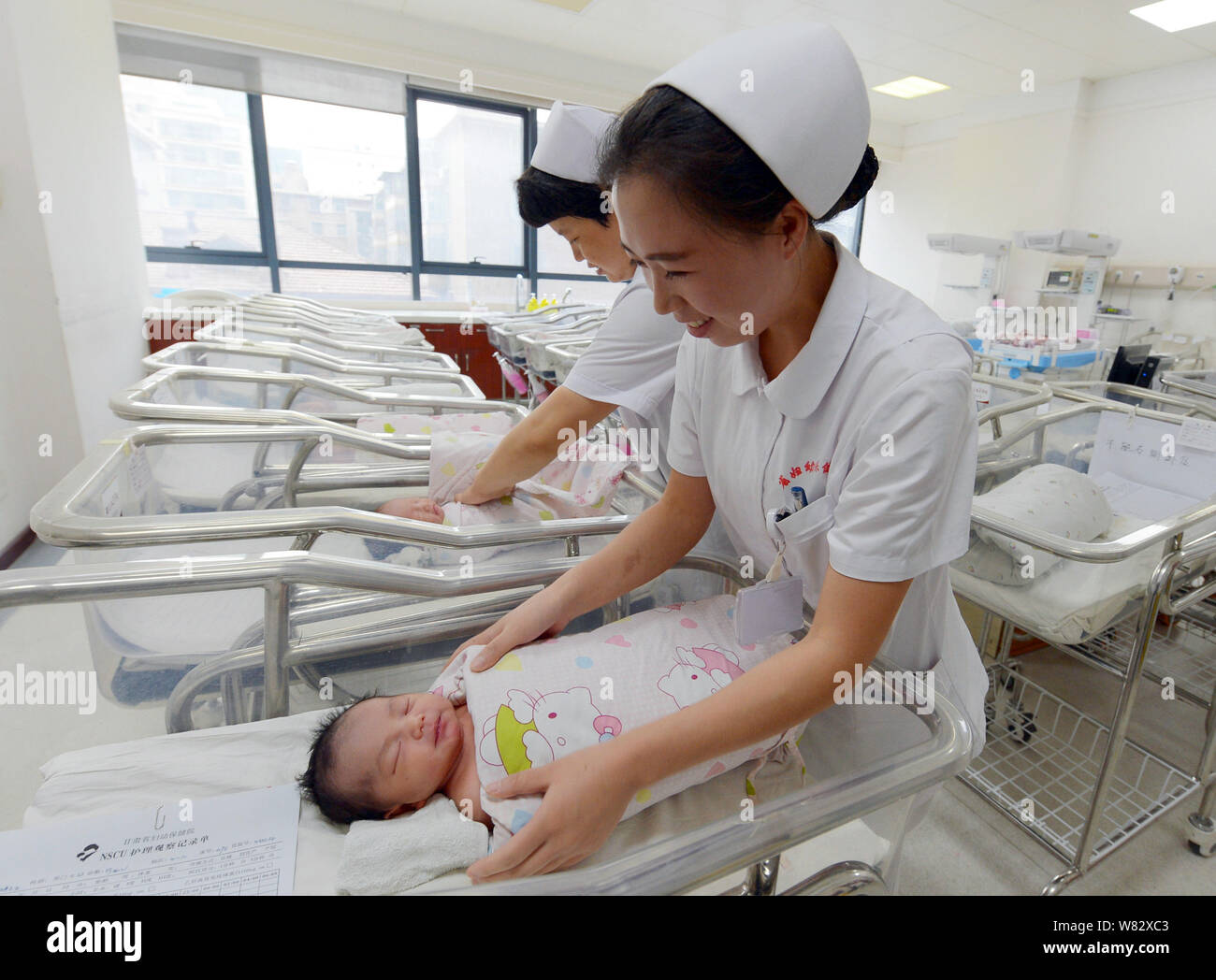 --FILE--Chinese nurses attend newborn infants at a hospital in Lanzhou ...