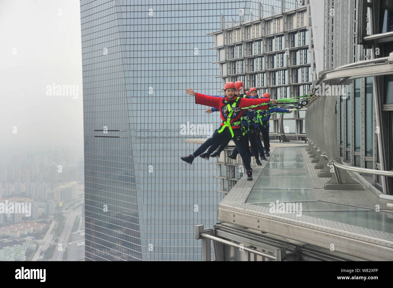 Chinese security worker Liu Jing and her colleagues equipped with ...