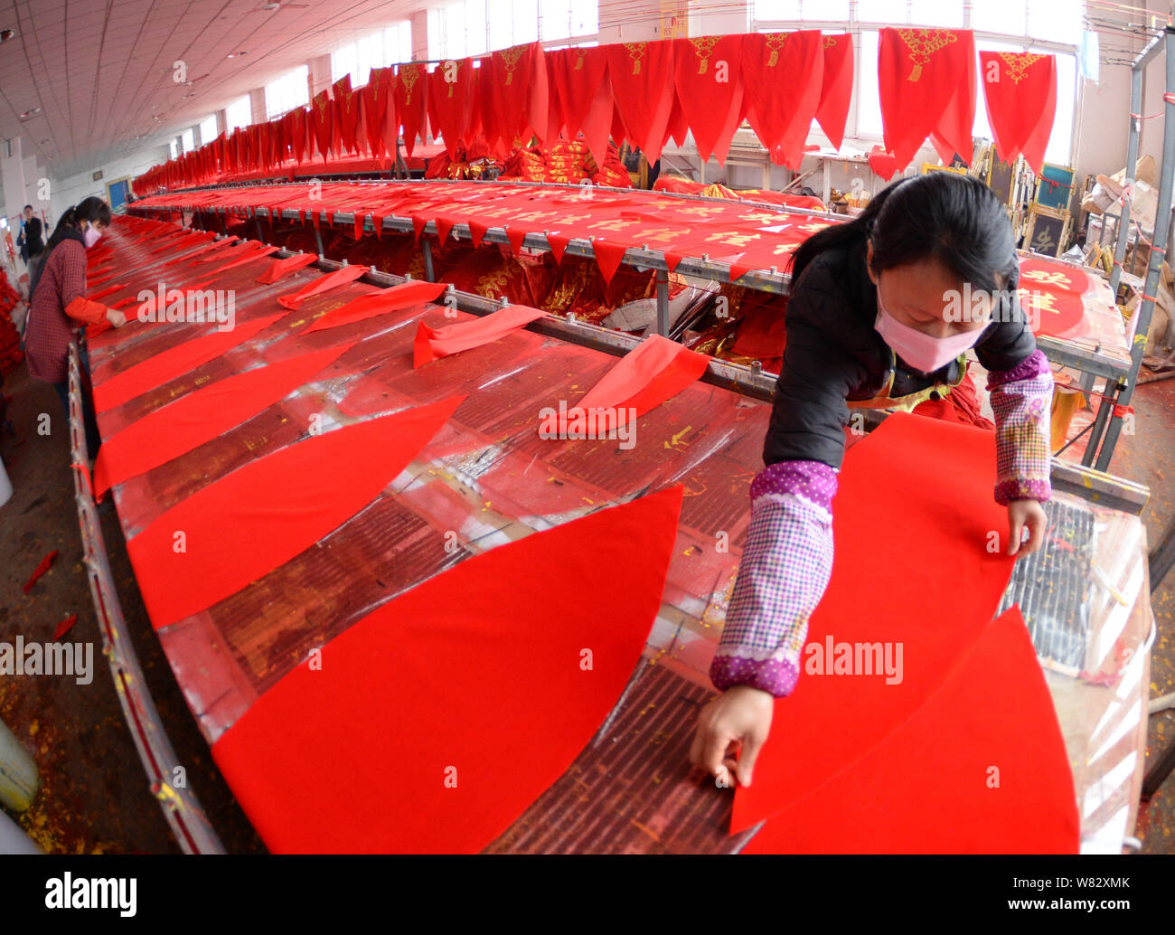 Chinese workers make red lanterns for the upcoming Chinese New Year ...