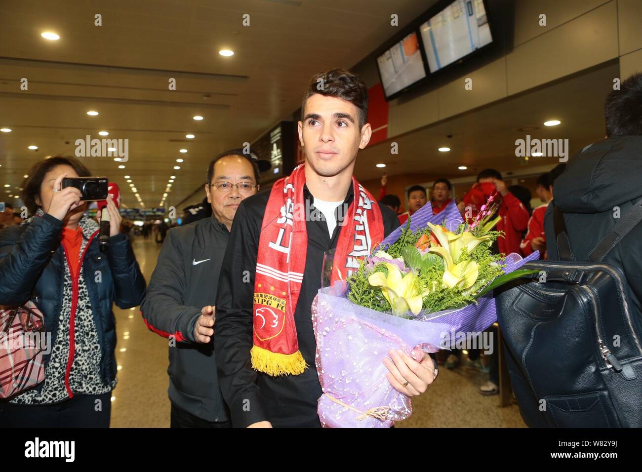 Brazilian football player Oscar is pictured after arriving at the Shanghai Pudong International ...