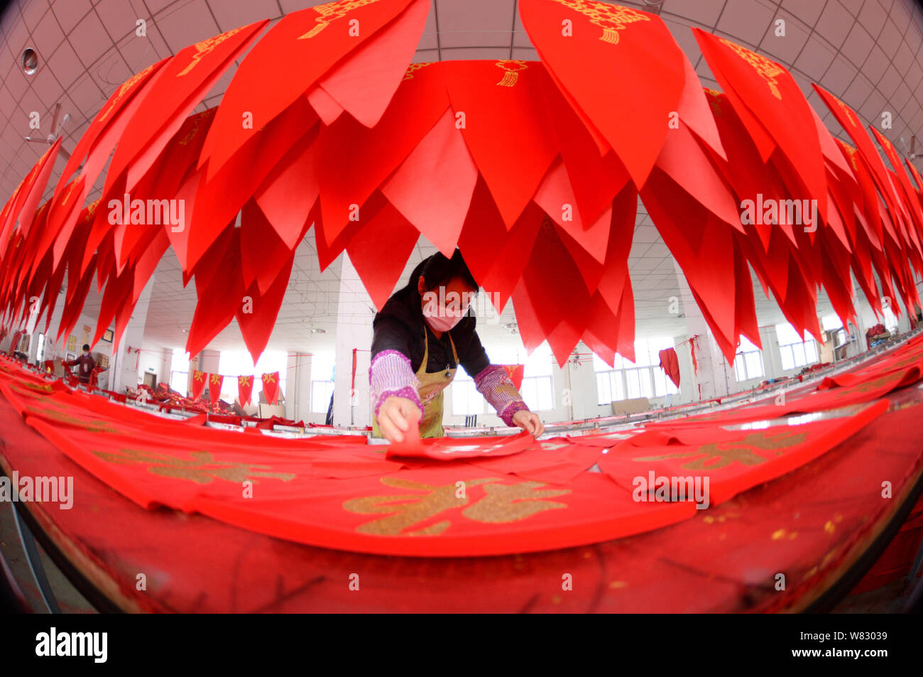 A Chinese worker makes red lanterns for the upcoming Chinese New Year ...