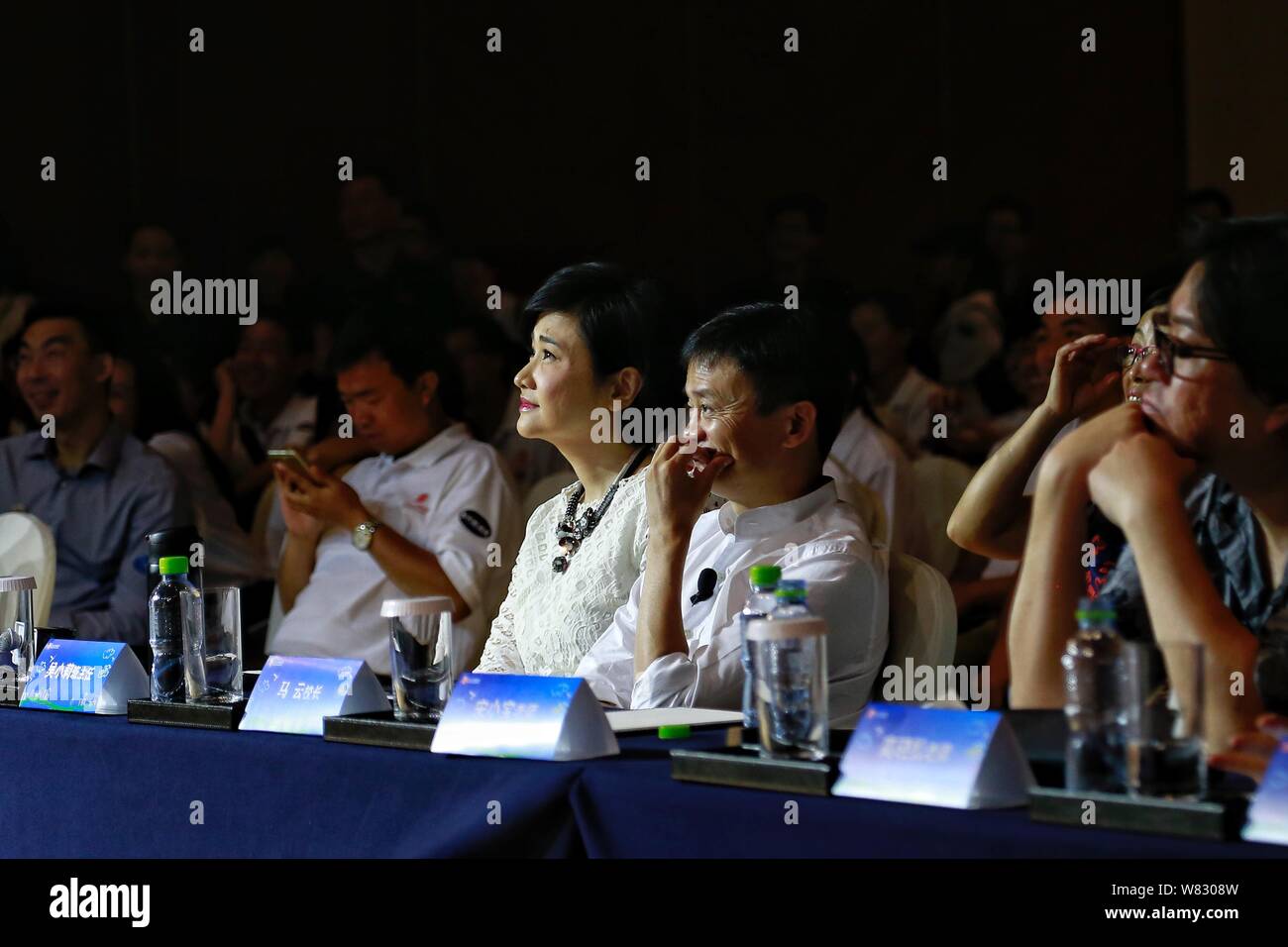 Jack Ma Yun, center, Chairman of Alibaba Group, listens to Chinese ...