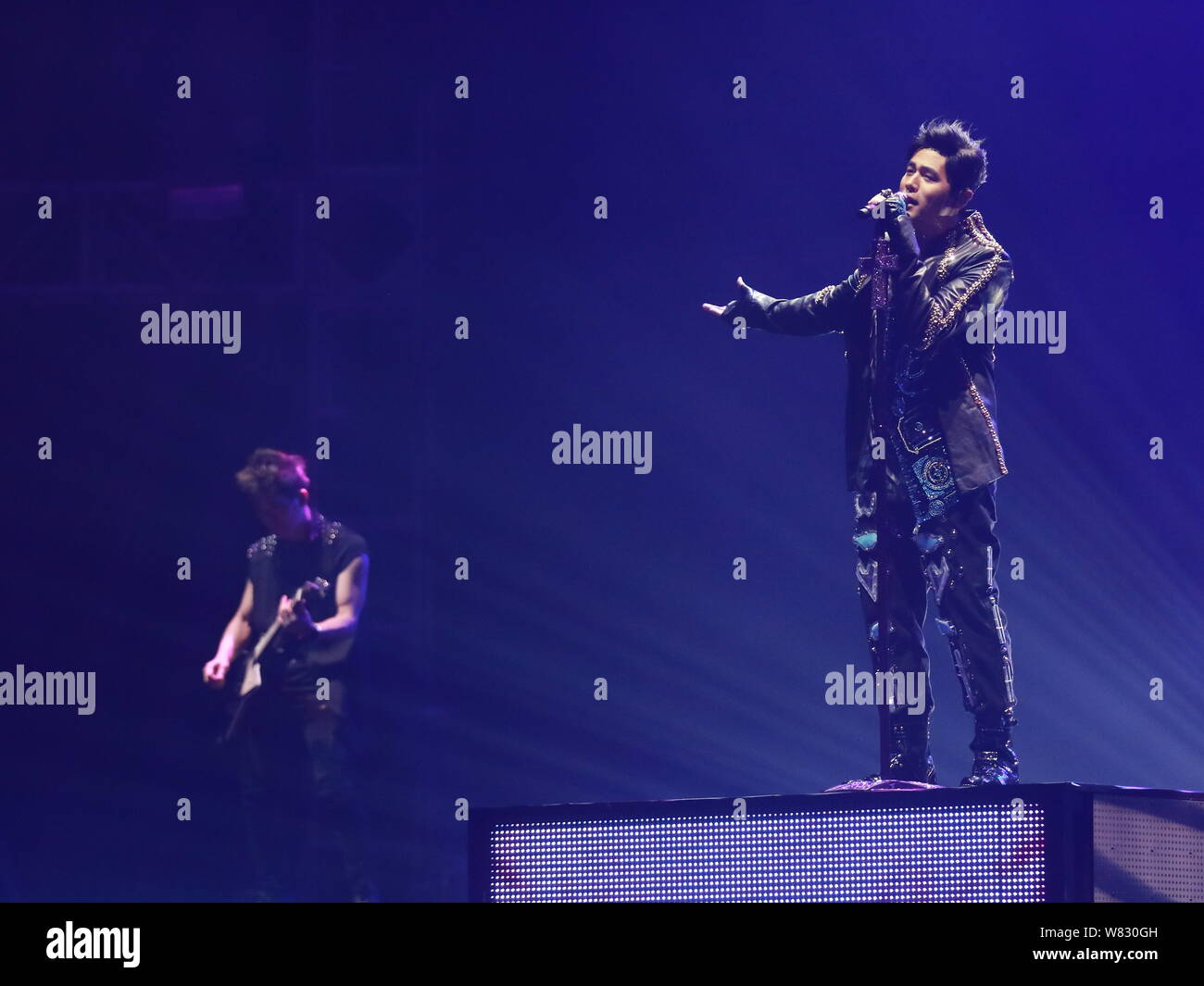 Taiwanese singer Jay Chou, right, poses at a concert during his "The ...