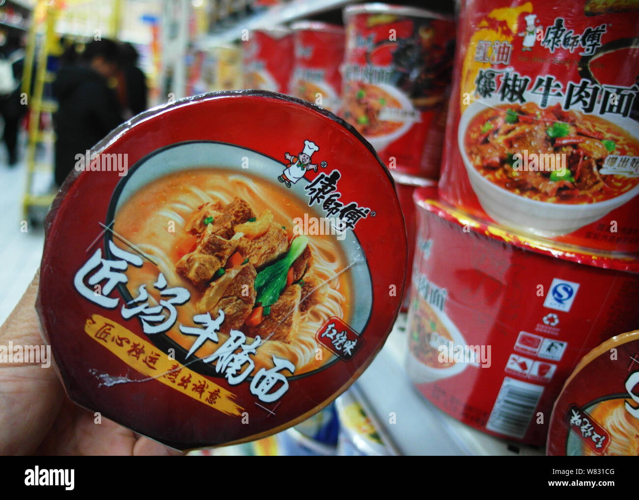 A Chinese customer shops for Master Kong instant noodle of Tingyi ...