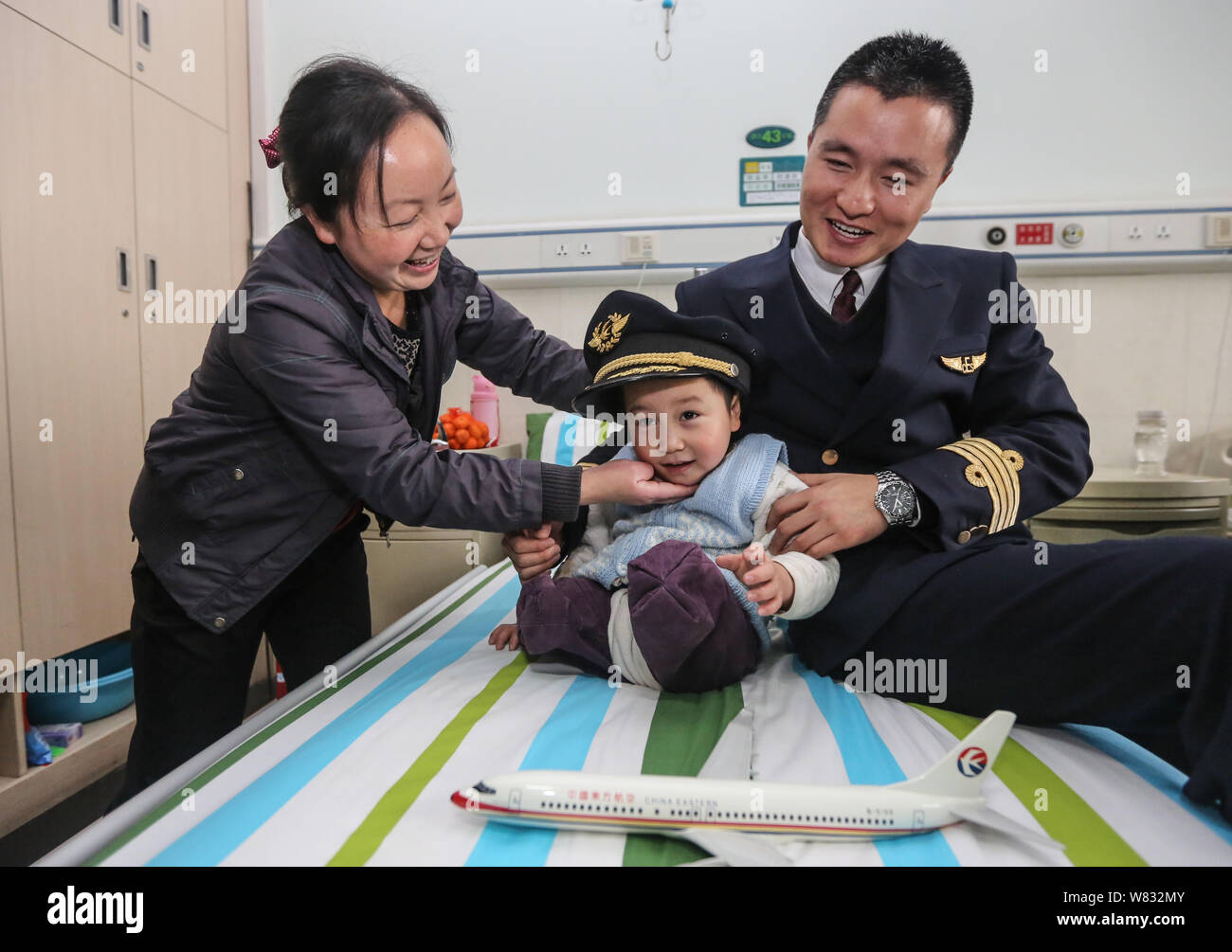 The mother, right, of the four-year-old legless boy Li Haifeng helps ...