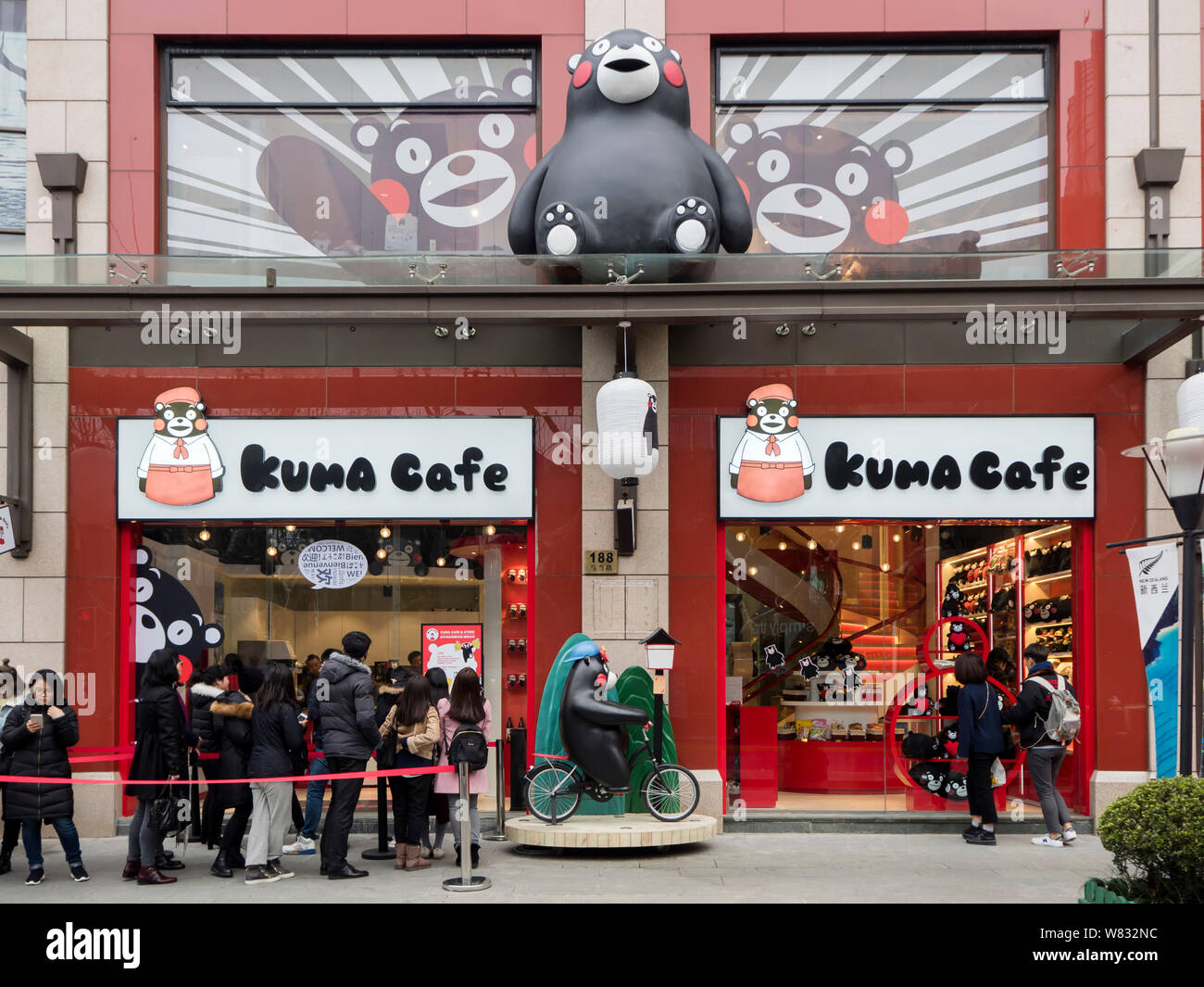 Customers queue up in front of the Kuma Cafe, featuring Kumamoto ...