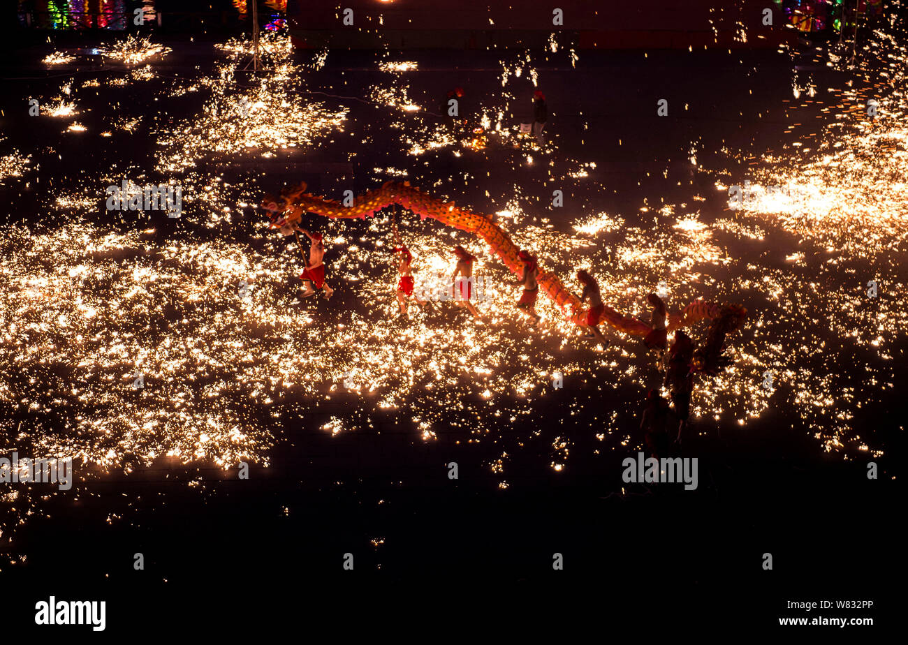Chinese people perform fire dragon dance to celebrate the upcoming ...