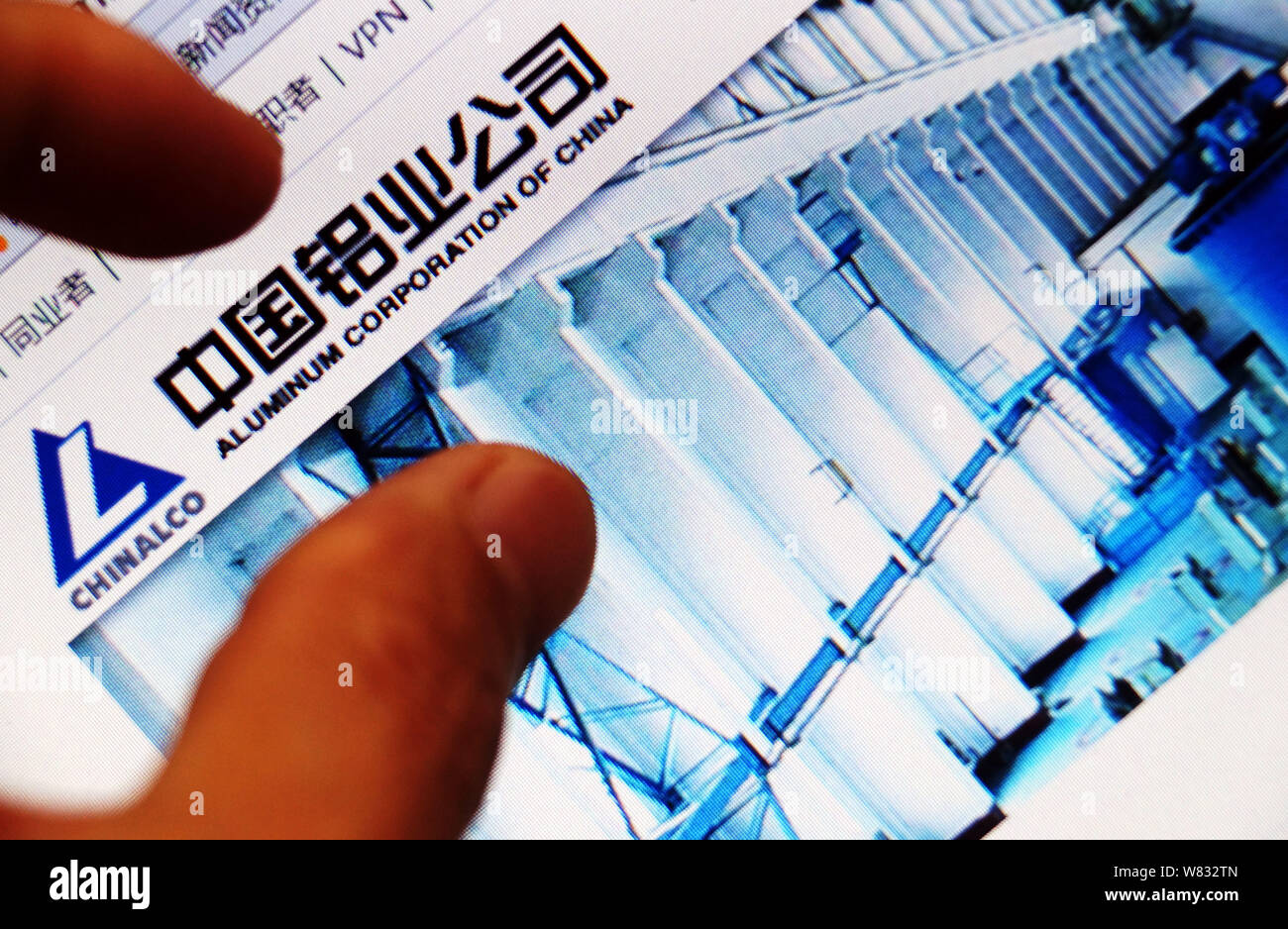 --FILE--A Chinese netizen browses the website of Chinalco (Aluminum ...