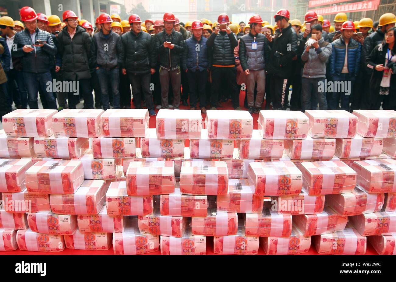 Bundles of 100-yuan RMB (Renminbi) banknotes for salaries and year-end ...