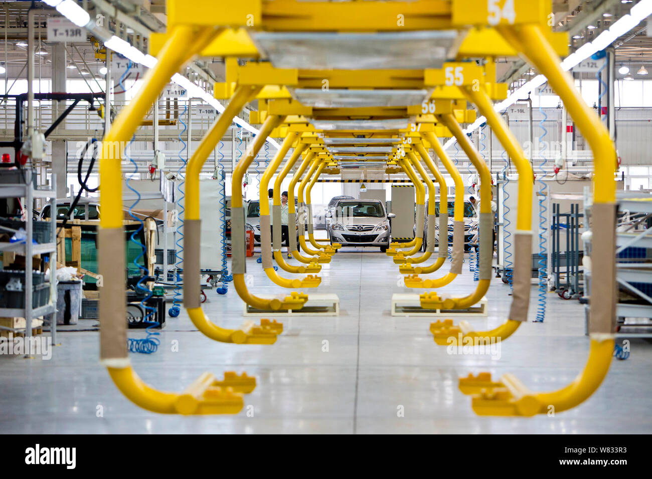--FILE--View of BAIC E150 electric cars on the assembly line at an auto plant in Beijing, China ...