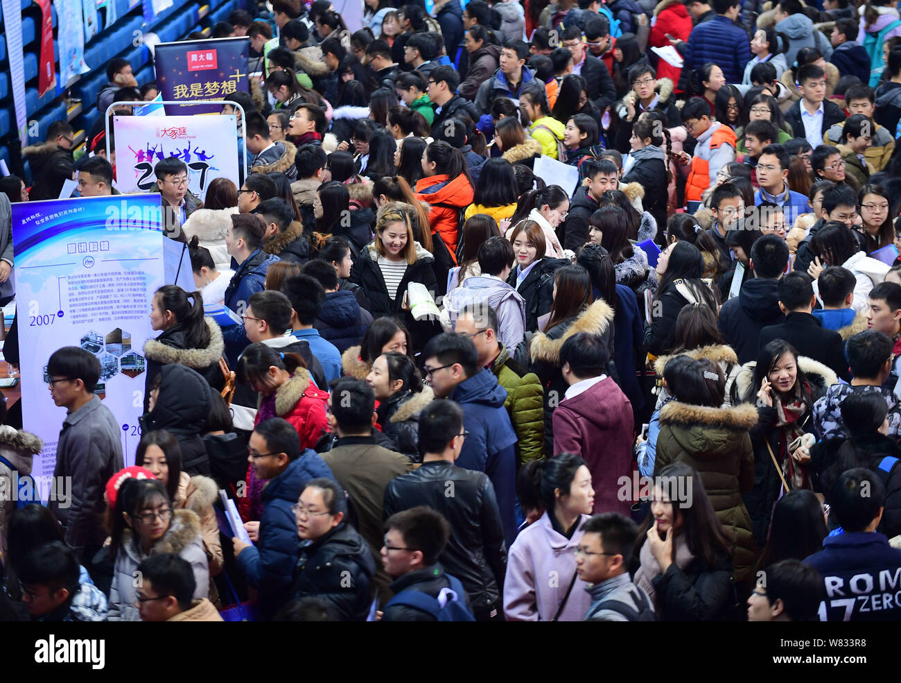 --FILE--Chinese students crowd booths to seek for employments during a ...