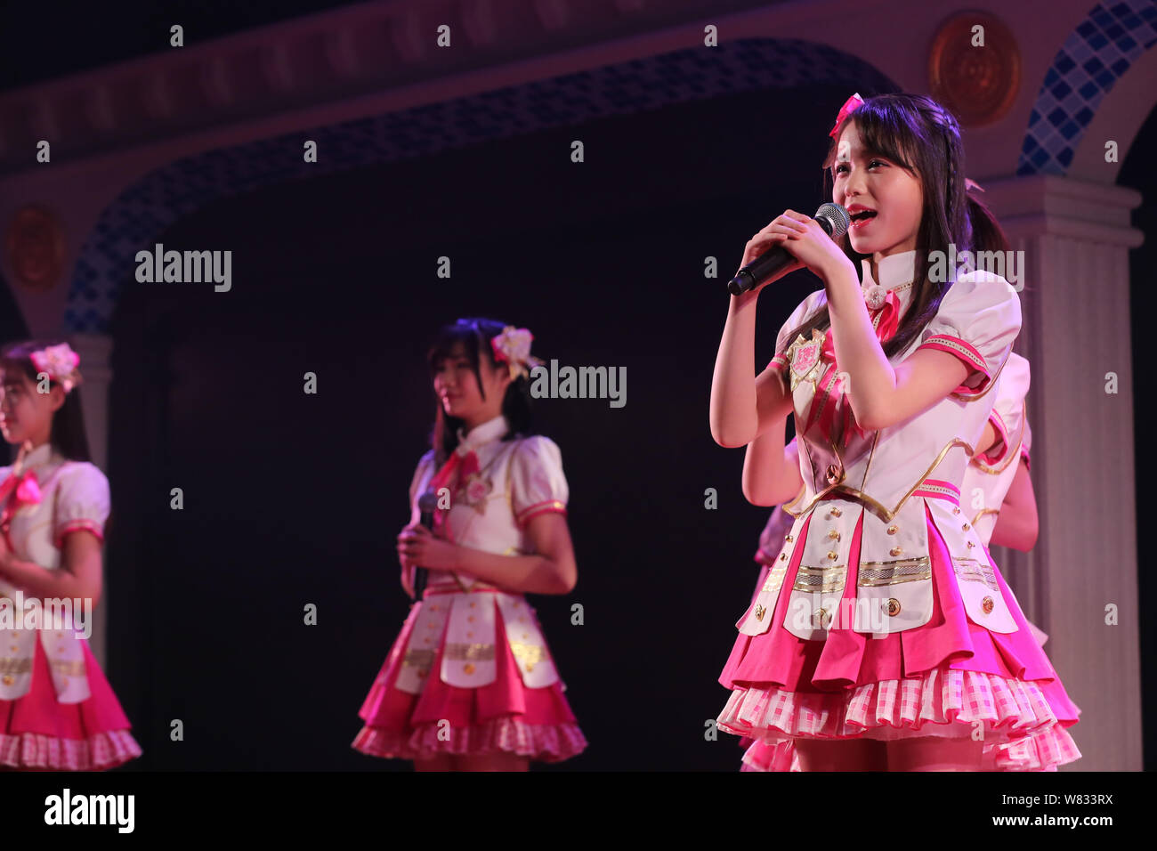 Members of Chinese girl group SHY48 perform during a press conference ...