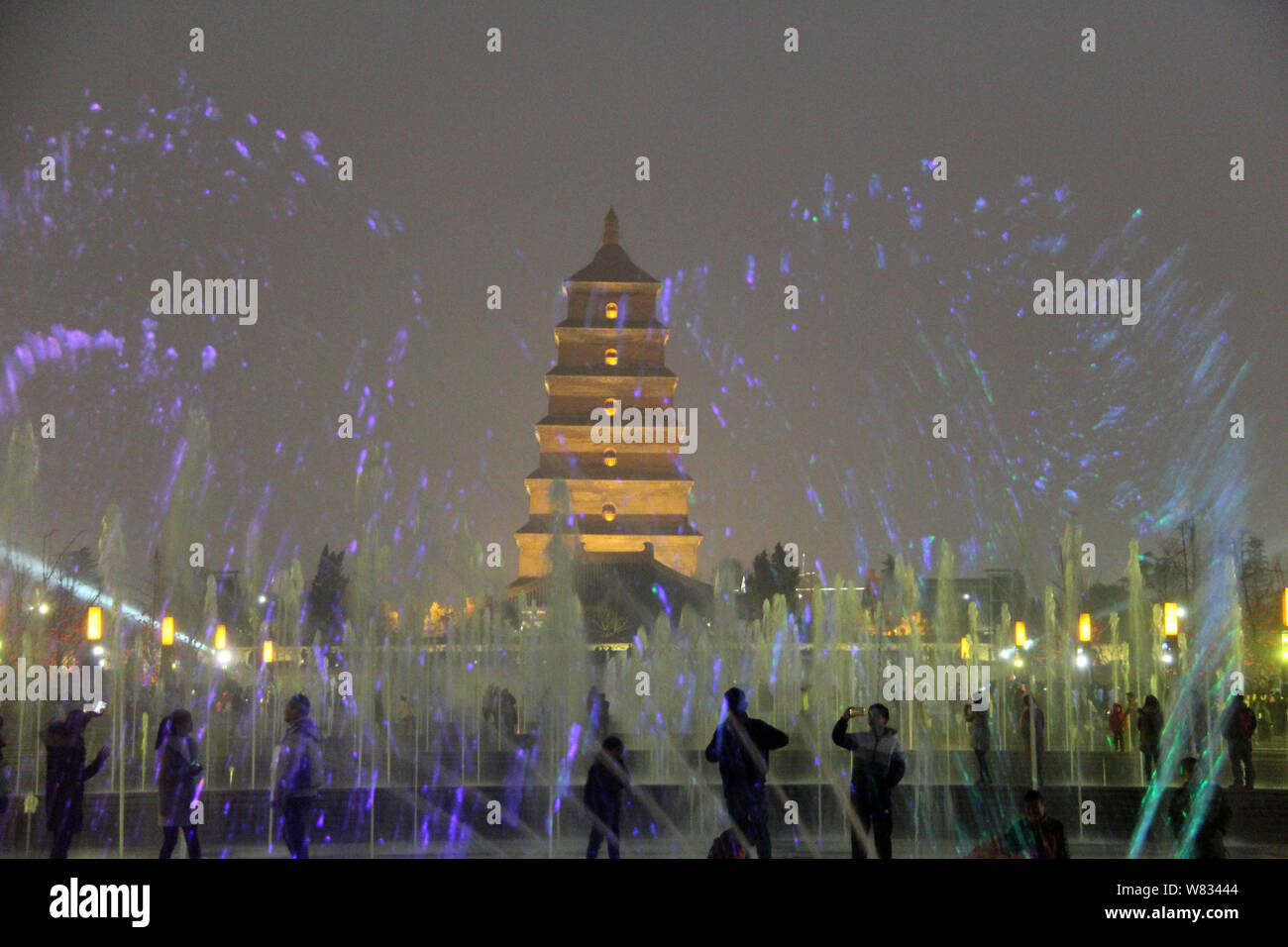 Tourists visit the Dayan Tower in heavy smog in Xi'an city, northwest ...