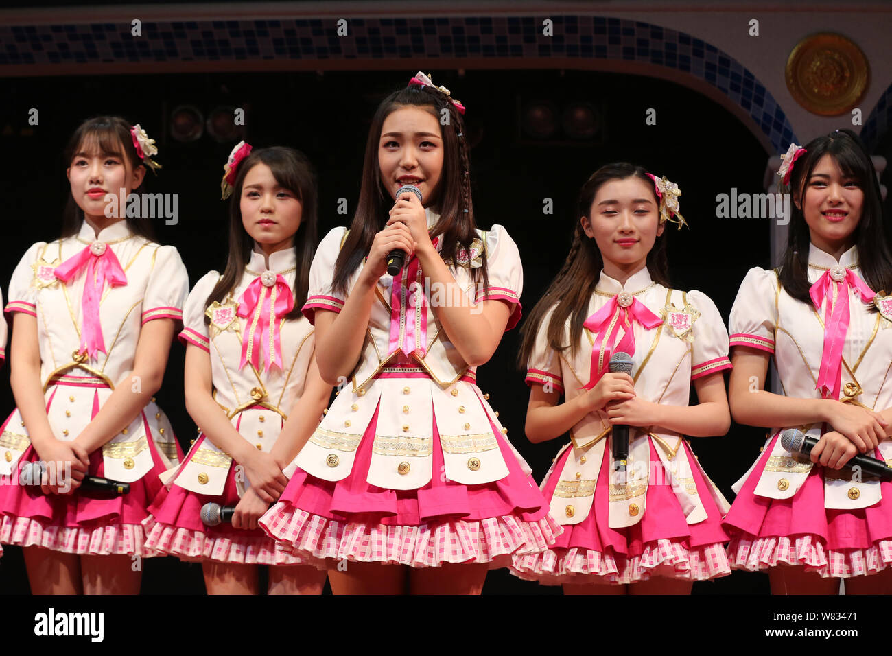 Members of Chinese girl group SHY48 perform during a press conference ...