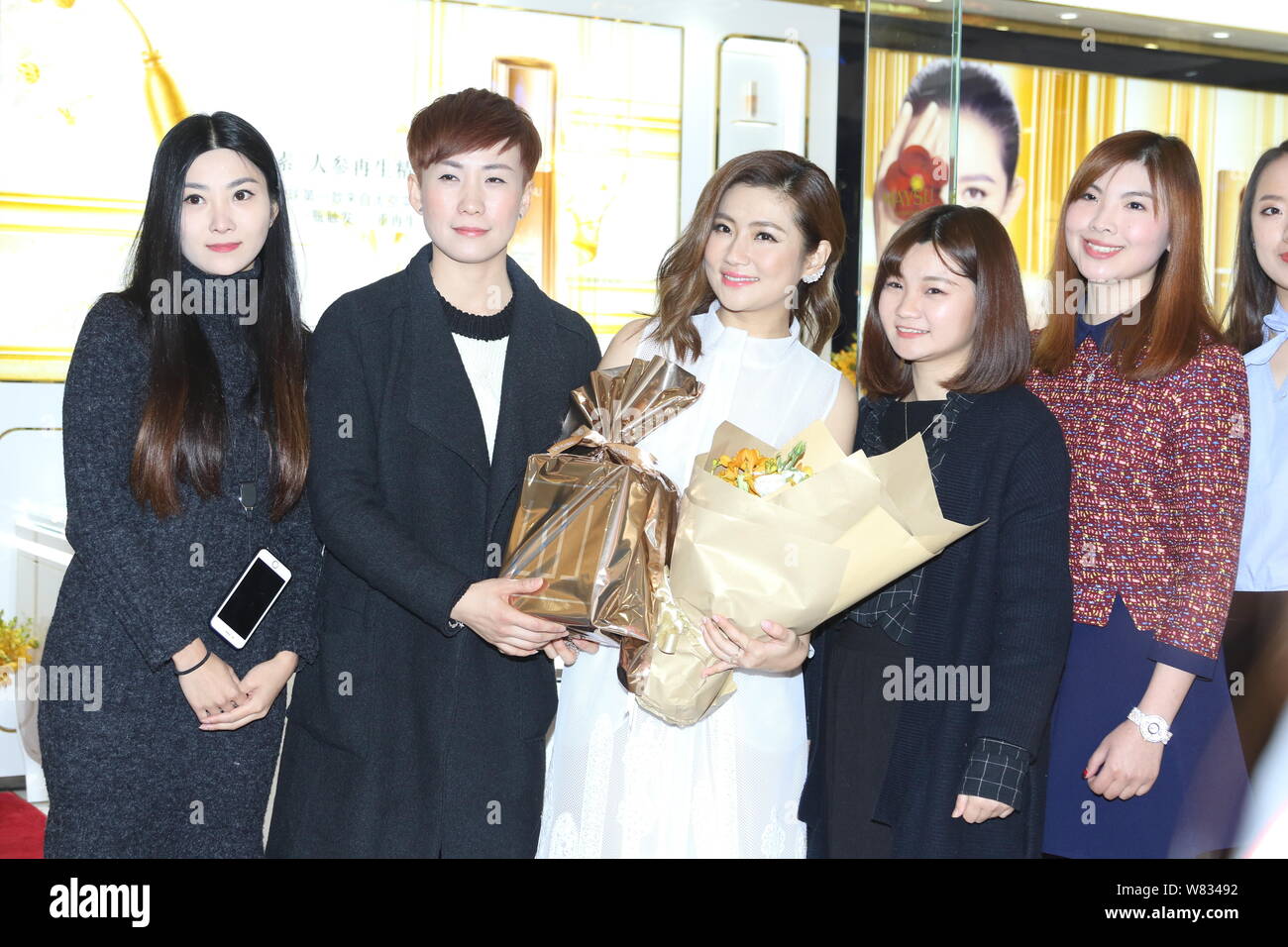 Selina Jen Chia-hsuan, third left, of Taiwanese girl group S.H.E attends a promotional event of ...