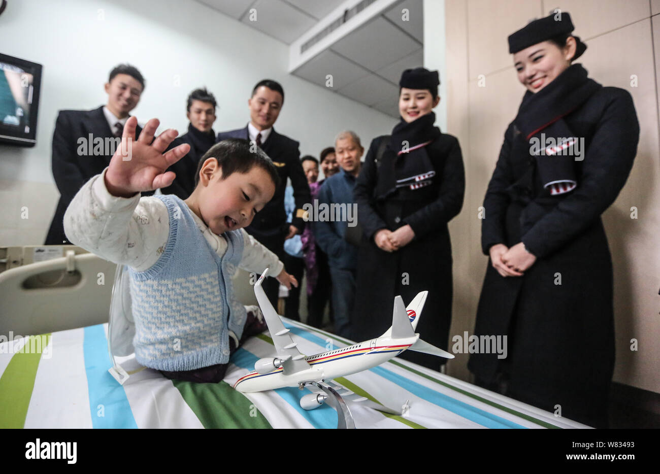 The four-year-old legless boy Li Haifeng, front left, plays with a ...