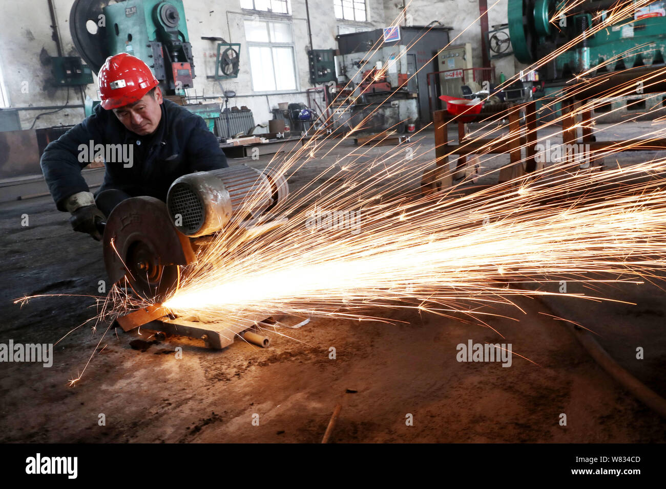 --FILE--A Chinese worker processes steel products at a steel plant in ...