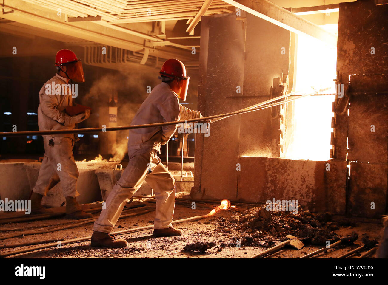 --FILE--Chinese workers produce steel at a steel plant in Hefei city ...