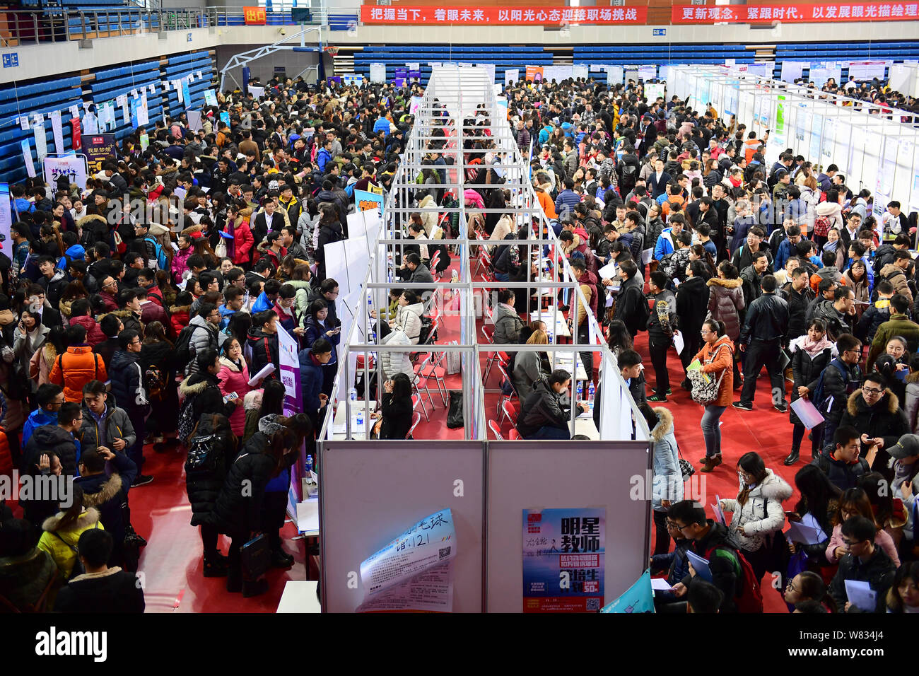 --FILE--Chinese students crowd booths to seek for employments during a ...