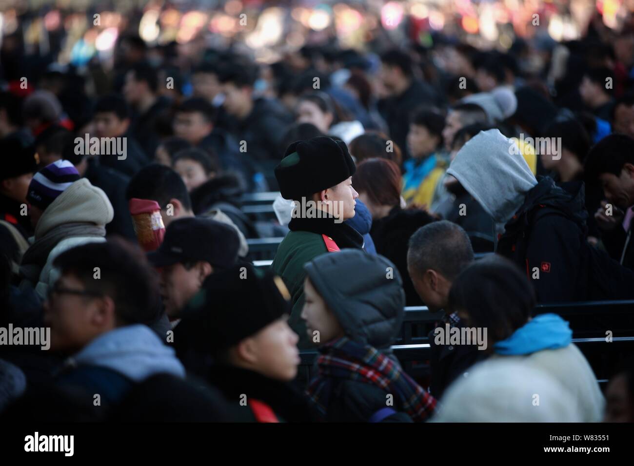 Passengers who go back home for the upcoming Chinese Lunar New Year ...