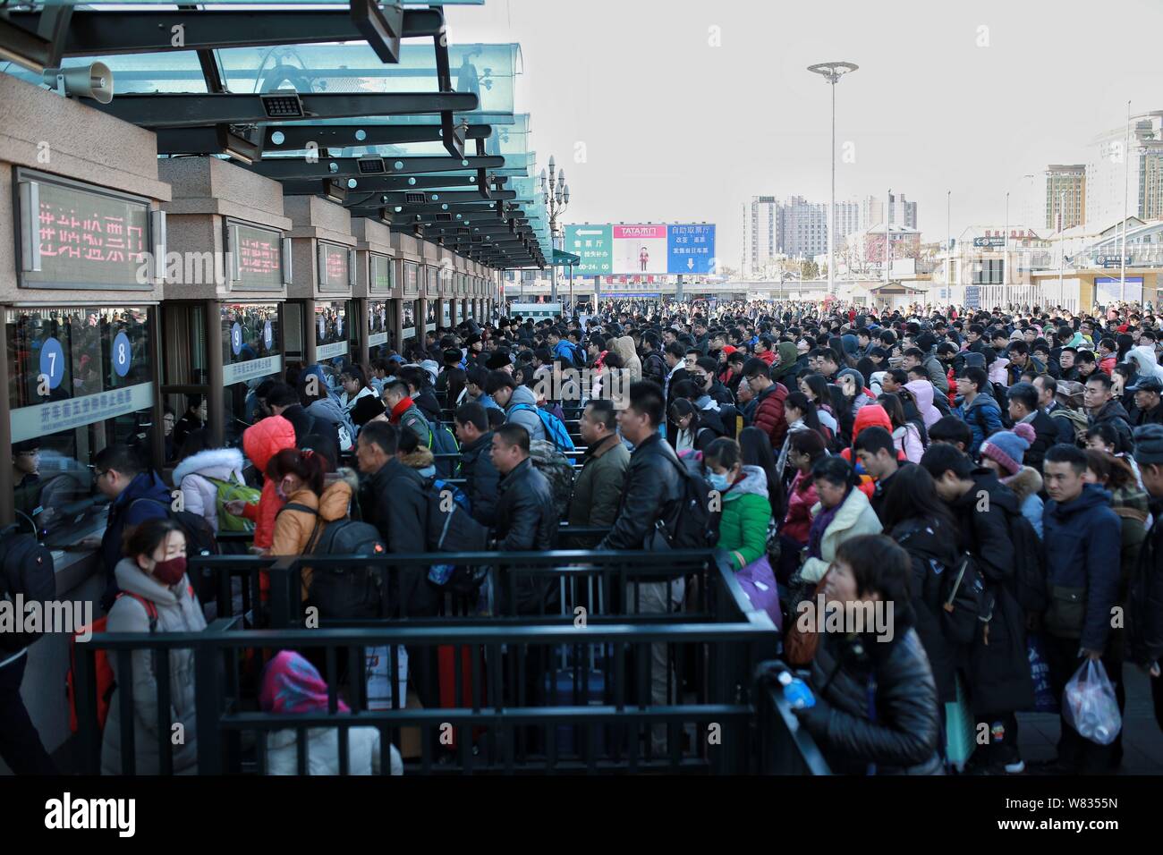 Passengers who go back home for the upcoming Chinese Lunar New Year ...