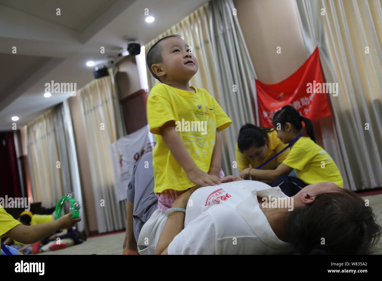 The four-year-old legless boy Li Haifeng attends a summer camp in ...