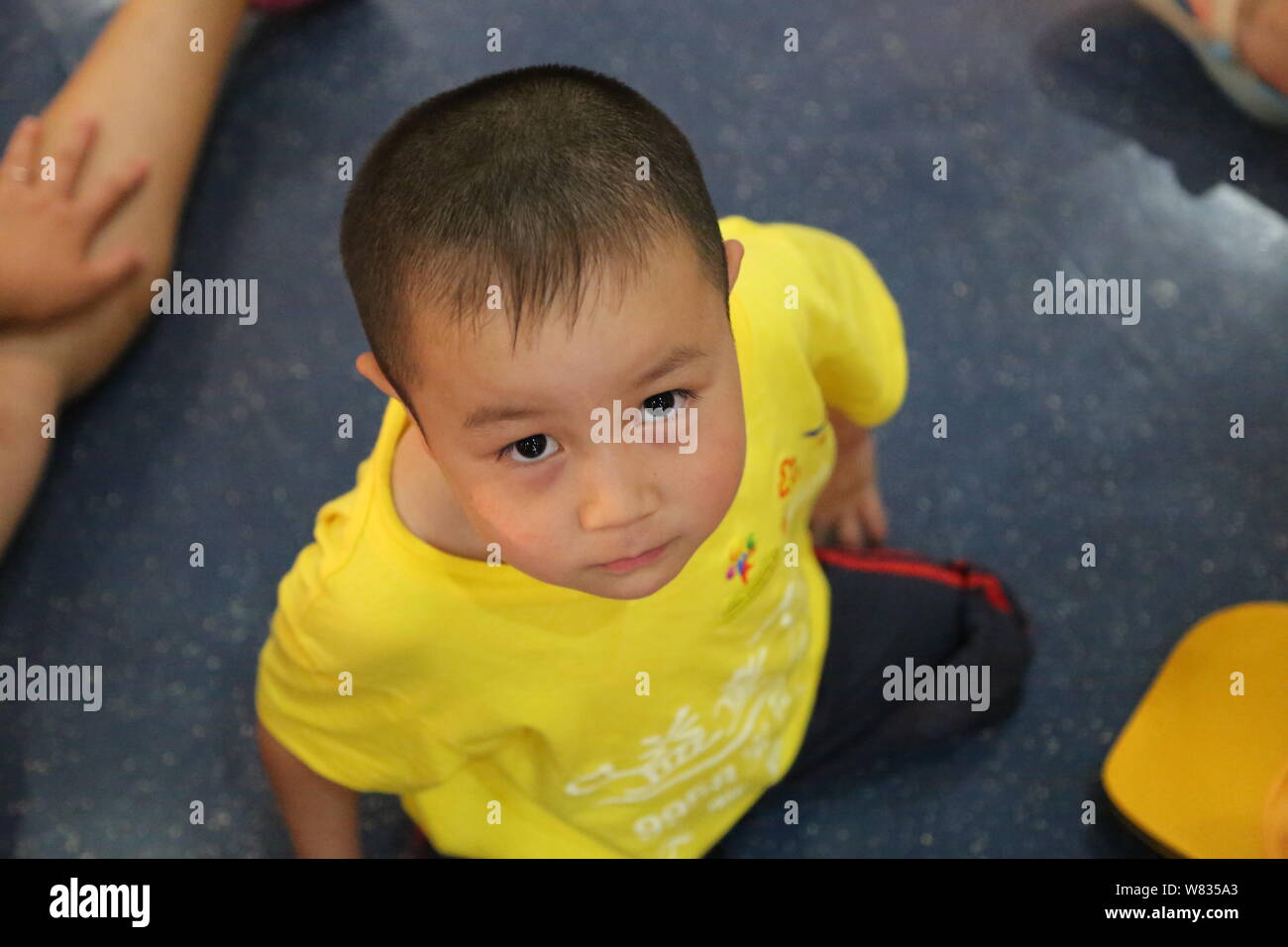 The four-year-old legless boy Li Haifeng attends a summer camp in ...