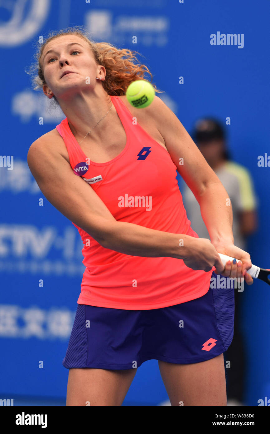 Katerina Siniakova of Czech Republic returns a shot to Nina Stojanovic ...