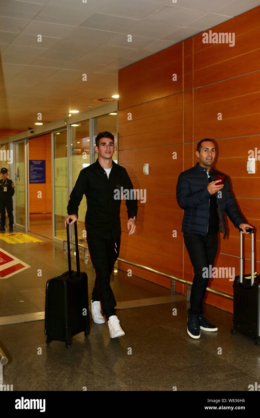 Brazilian football player Oscar, left, is pictured after arriving at ...