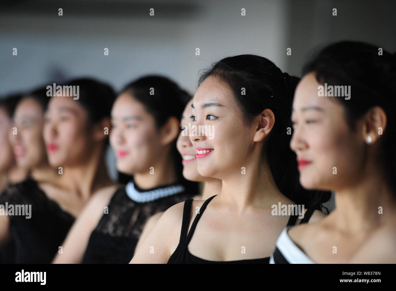 Female students take part in a model training session at a school in ...