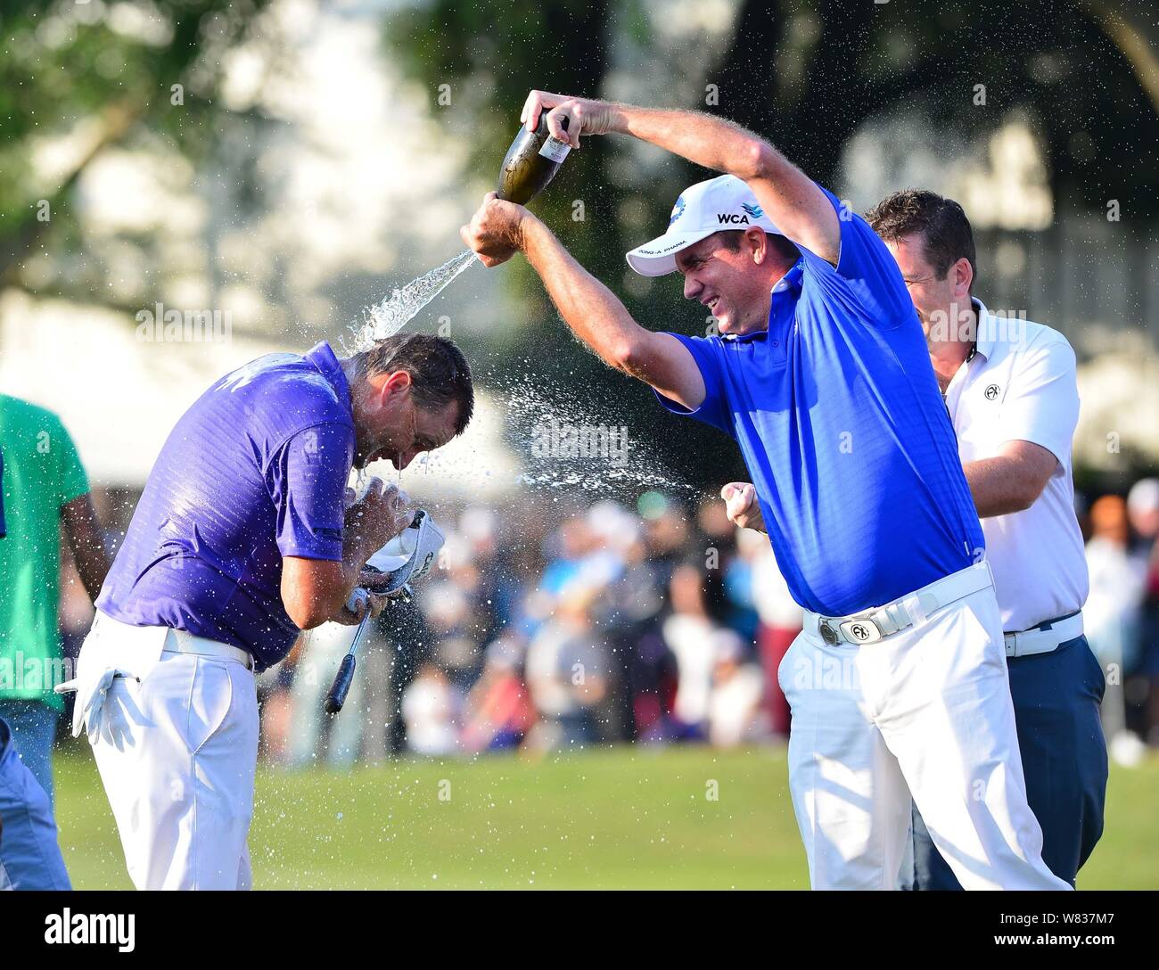 Australian golfer Sam Brazel, left, celebrates after winning the UBS ...