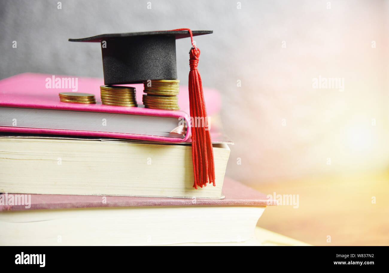 Scholarships education concept with graduation cap on coin money saving ...