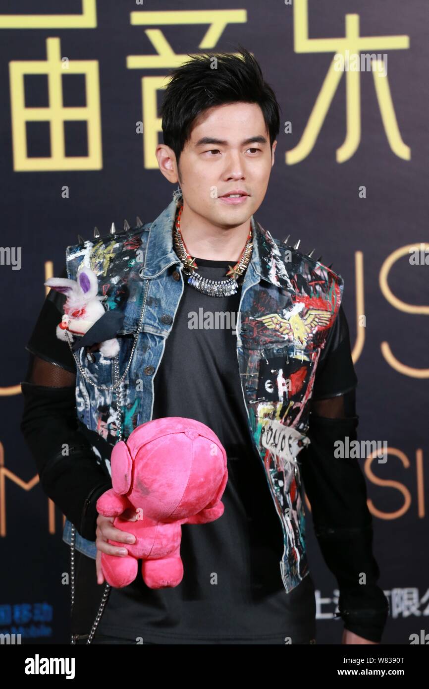 Taiwanese singer Jay Chou arrives on the red carpet for the 10th Migu ...