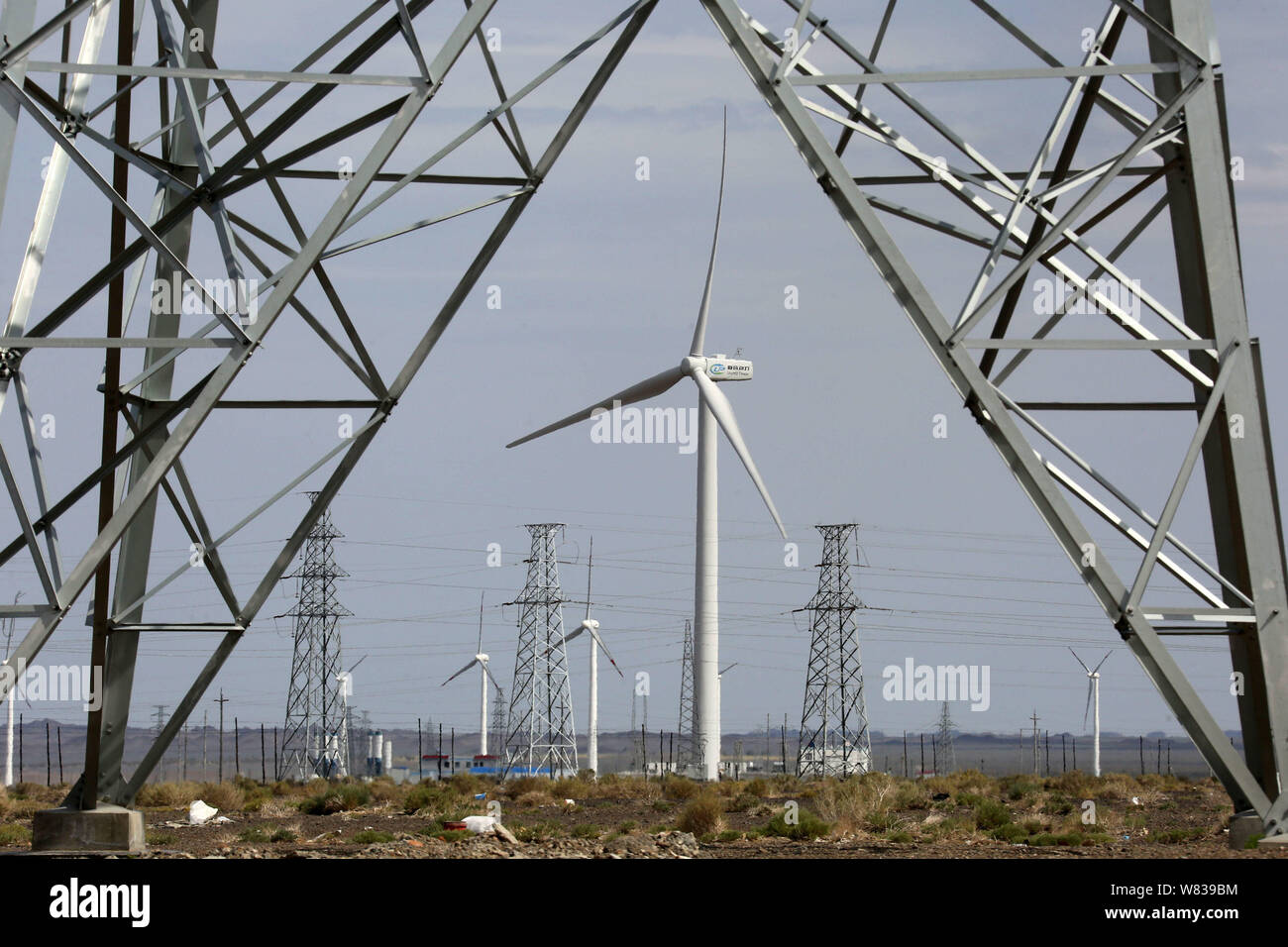 --FILE--Wind turbines whirl to generate electricity at a wind farm in ...