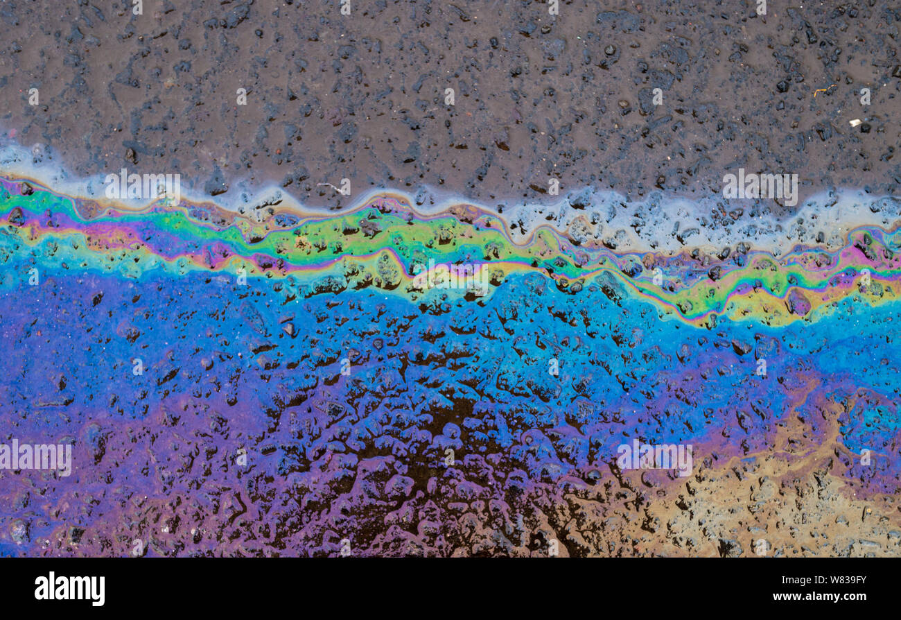 Oil spill on wet Tar road creating rainbow colours near Satara ...