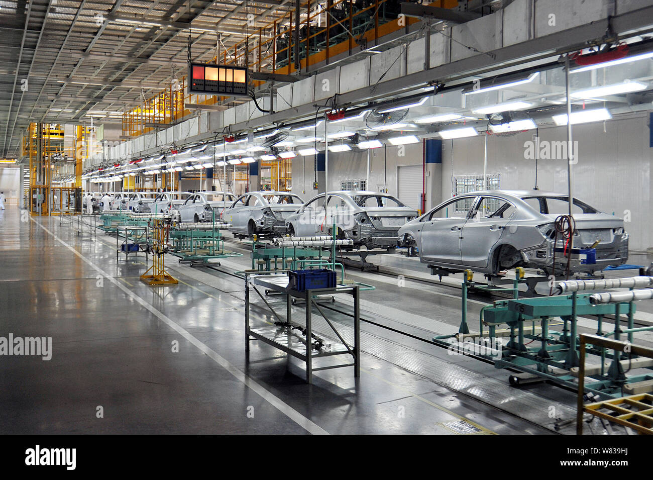 --FILE--Cars are being manufactured on the assembly line at an auto ...